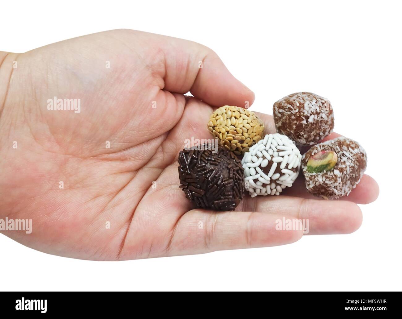 Sweet Food, Hand Holding Assorted Round Chocolate Candy Balls or ...