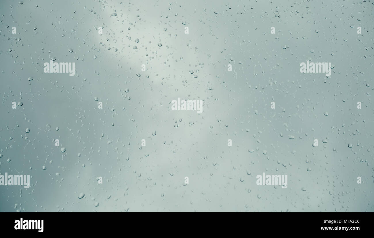Raindrops on glass overcast sky hi-res stock photography and images - Alamy
