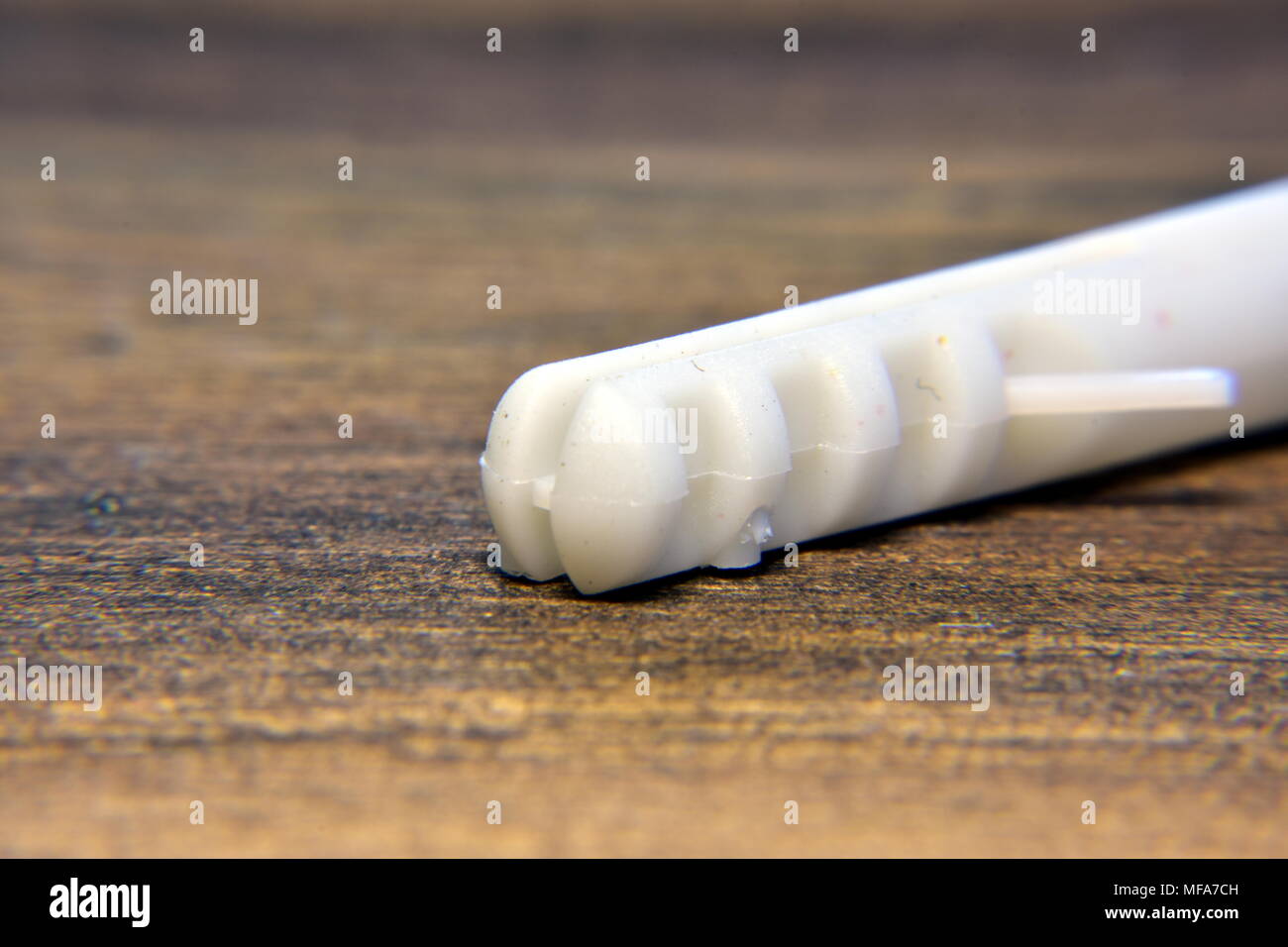 White wall screw plug Stock Photo - Alamy