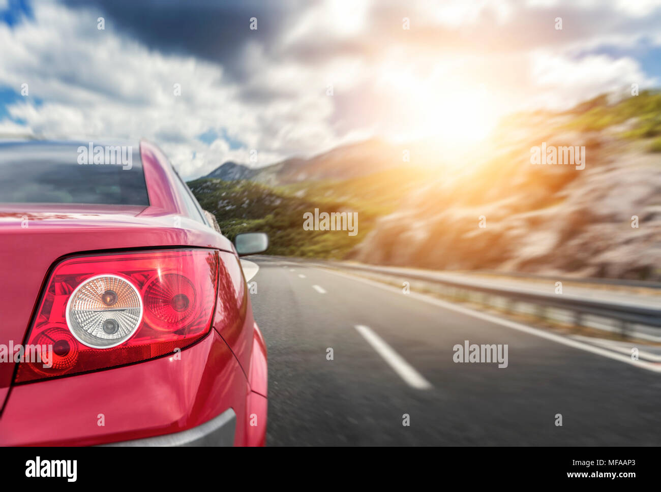 Red car driving landscape hi-res stock photography and images - Alamy