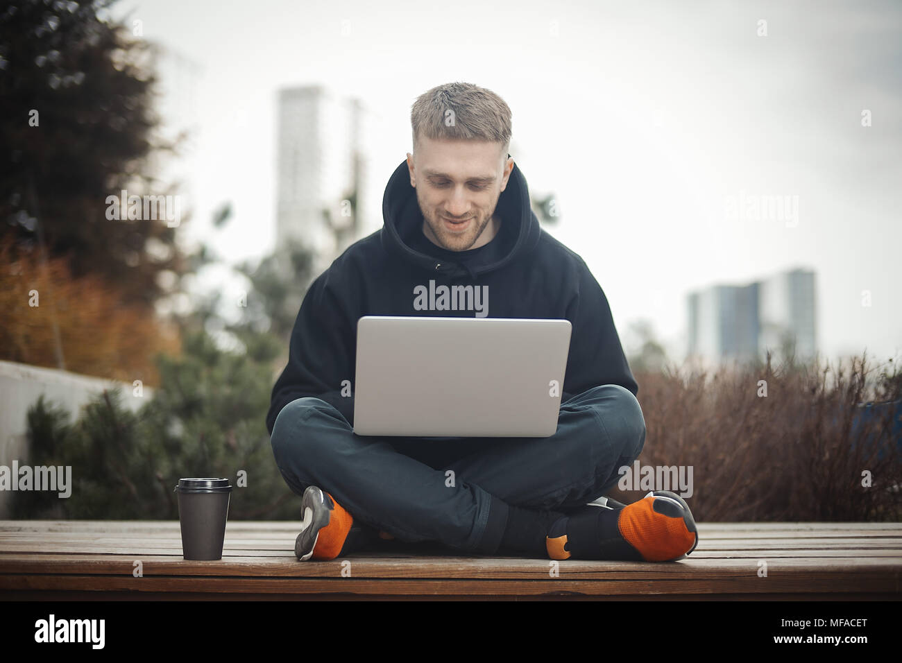 Man smiling holding coffee hi-res stock photography and images - Alamy