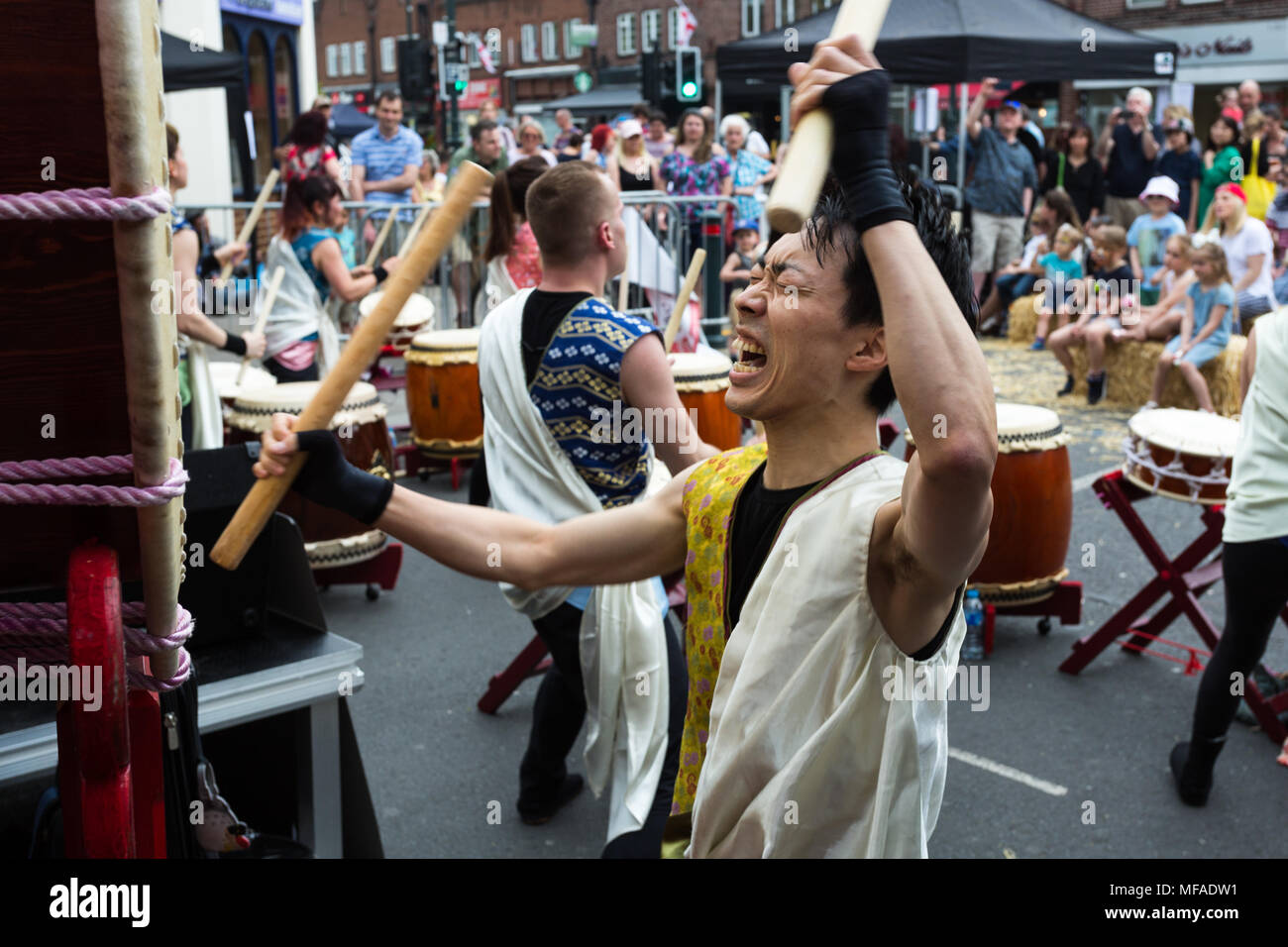 Musician beating large Japanese ō-daiko drum with Bachi sticks for Joji ...