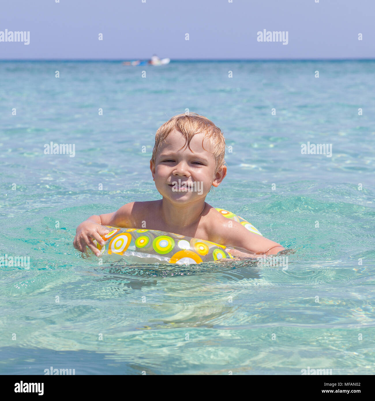 Child playing in sea hi-res stock photography and images - Alamy