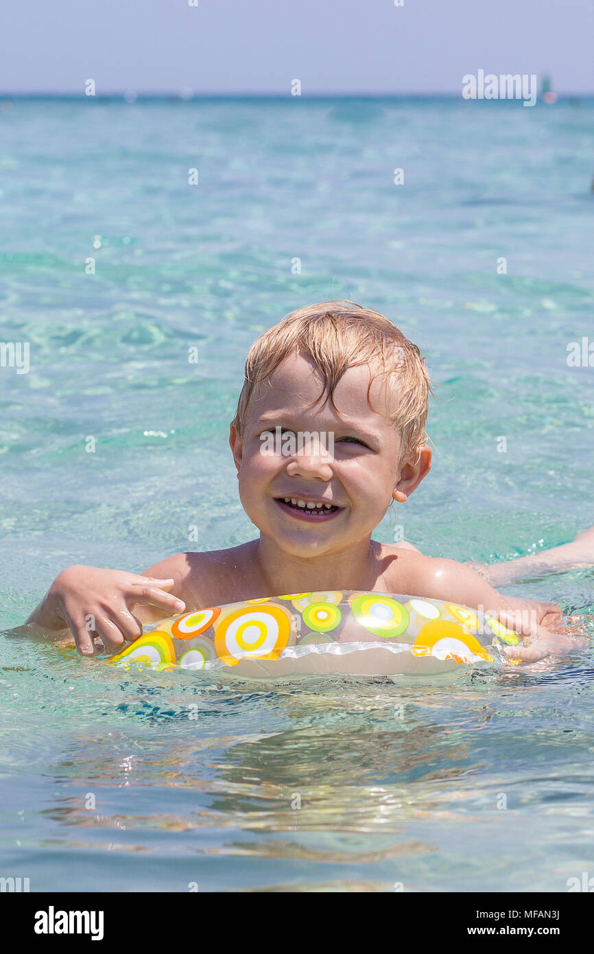 Child playing in sea hi-res stock photography and images - Alamy