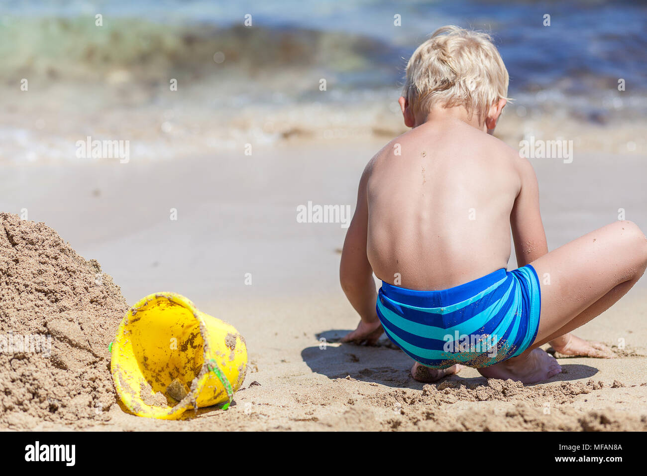 Playing beach sand hi-res stock photography and images - Alamy