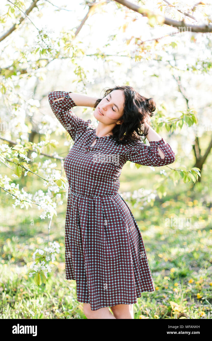 nature, freedom, happiness concept. there is a woman who is enjoying ...