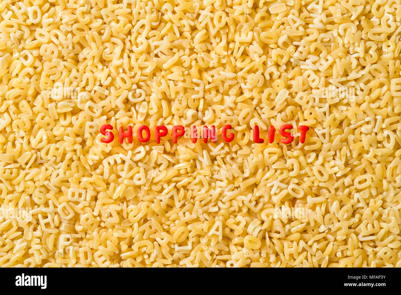 The words "SHOPPING LIST" are spelled with red colored abc pasta ...