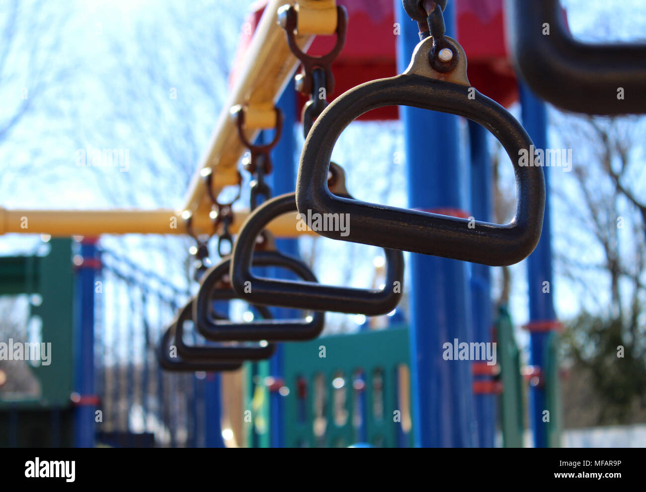 Children climbing on monkey bars hi-res stock photography and images ...