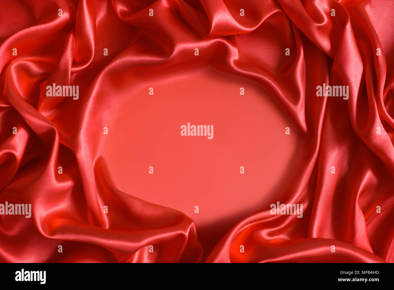 Close up of ripples in red silk fabric. Frame made of fabric. Satin ...