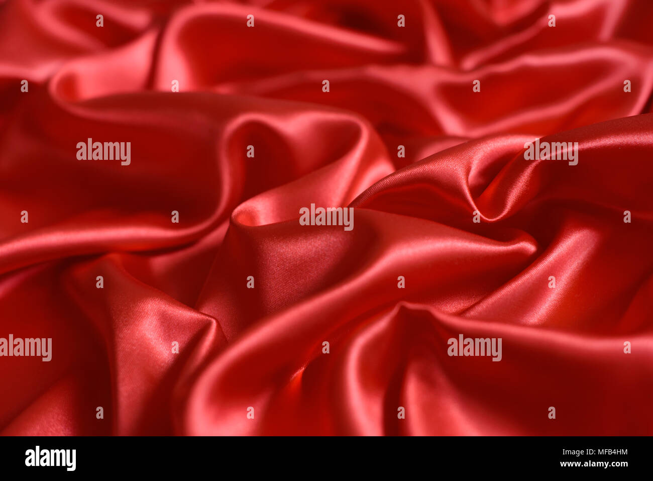 Close up of ripples in red silk fabric. Satin textile background Stock ...