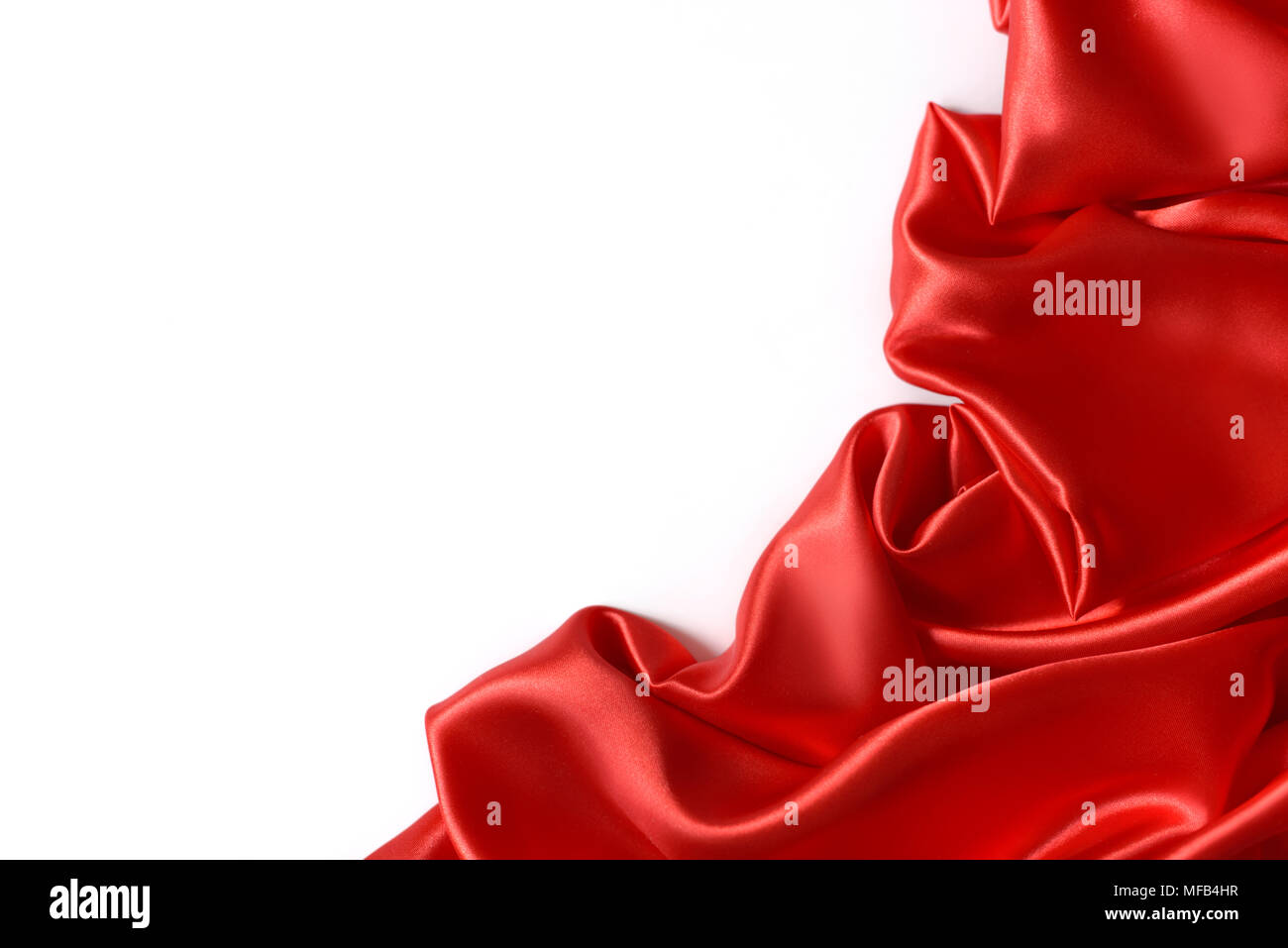 Close up of ripples in red silk fabric. Satin textile background with ...