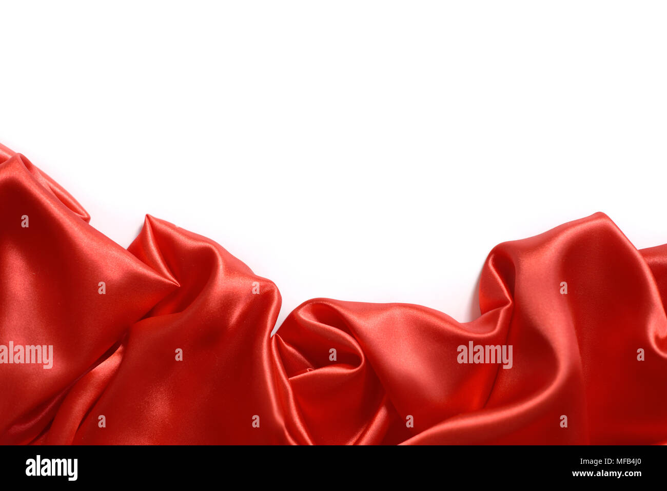 Close up of ripples in red silk fabric. Satin textile background with ...