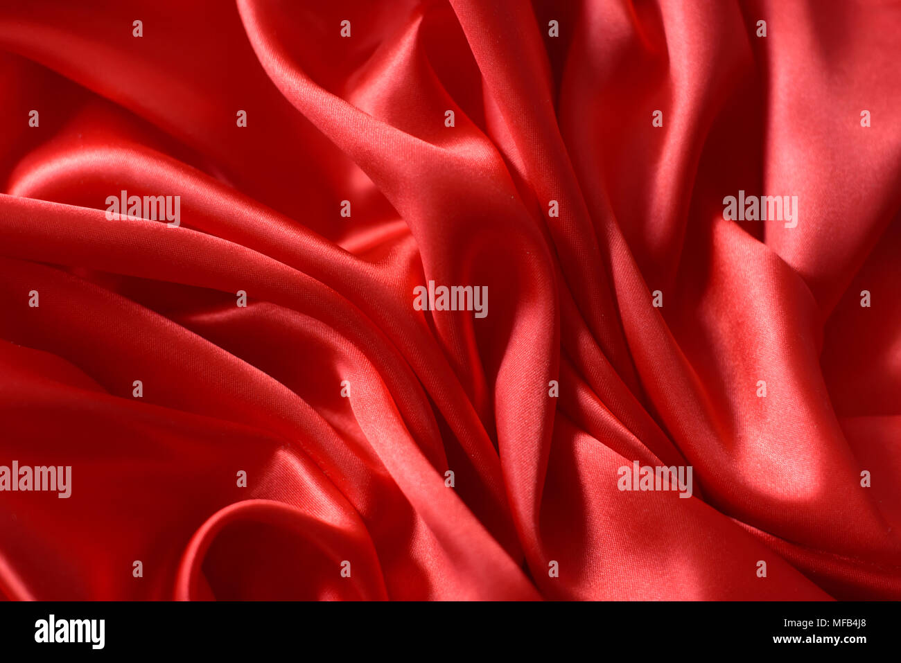 Close up of ripples in red silk fabric. Satin textile background Stock ...