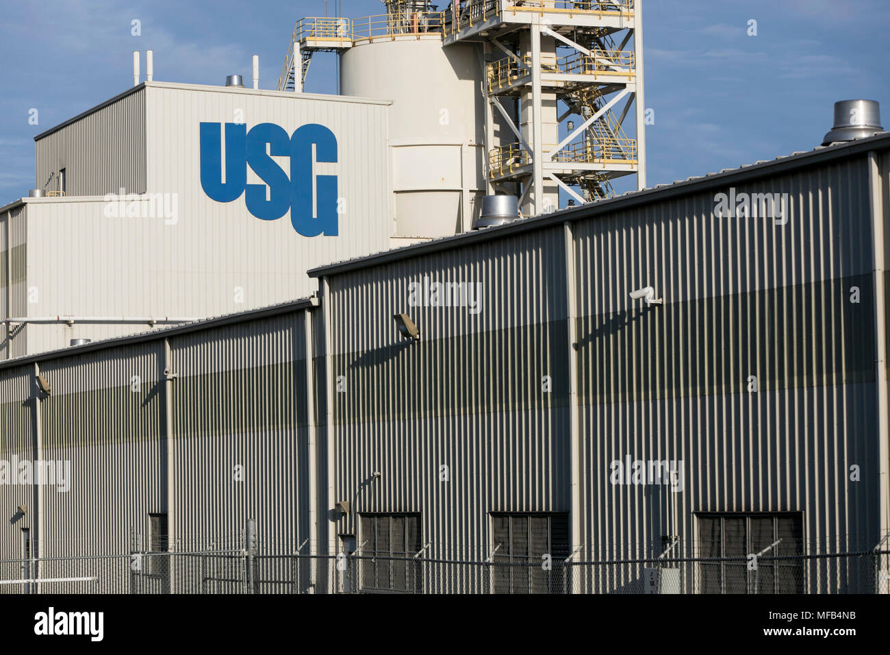 A logo sign outside of a facility occupied by the USG Corporation, also ...