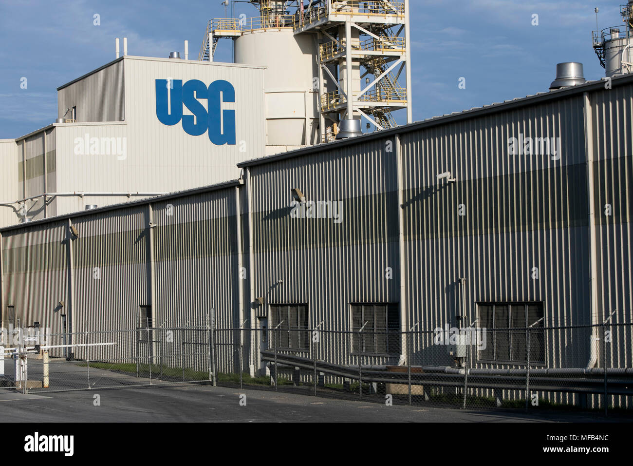 A logo sign outside of a facility occupied by the USG Corporation, also ...