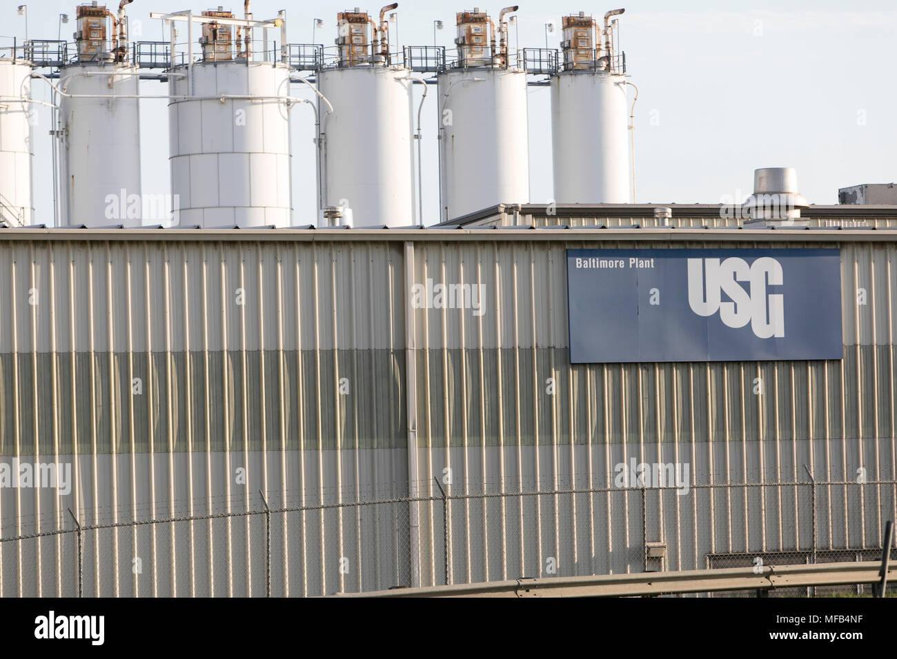A logo sign outside of a facility occupied by the USG Corporation, also ...