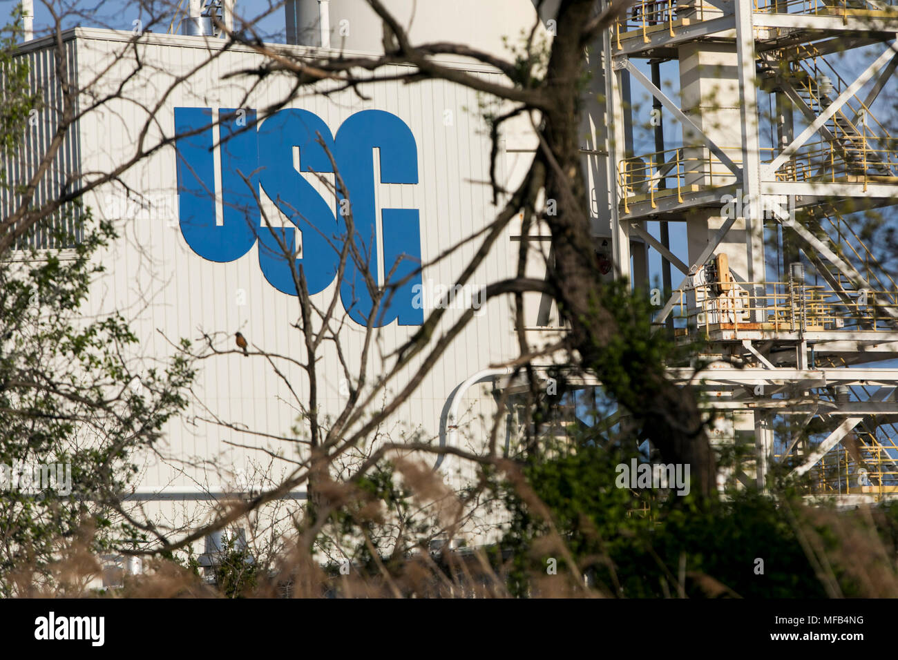 A logo sign outside of a facility occupied by the USG Corporation, also ...
