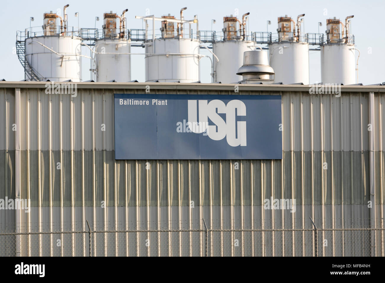 A logo sign outside of a facility occupied by the USG Corporation, also ...
