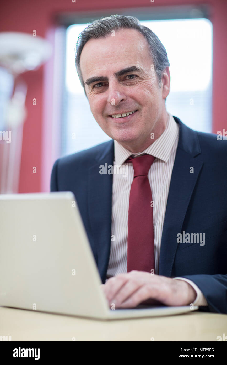 Mature businessman desk suit hi-res stock photography and images - Alamy