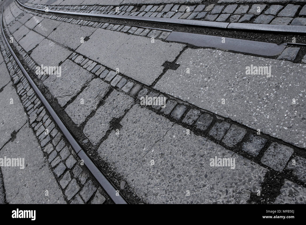 A detail picture of the old railway with pavement from stone bricks and ...