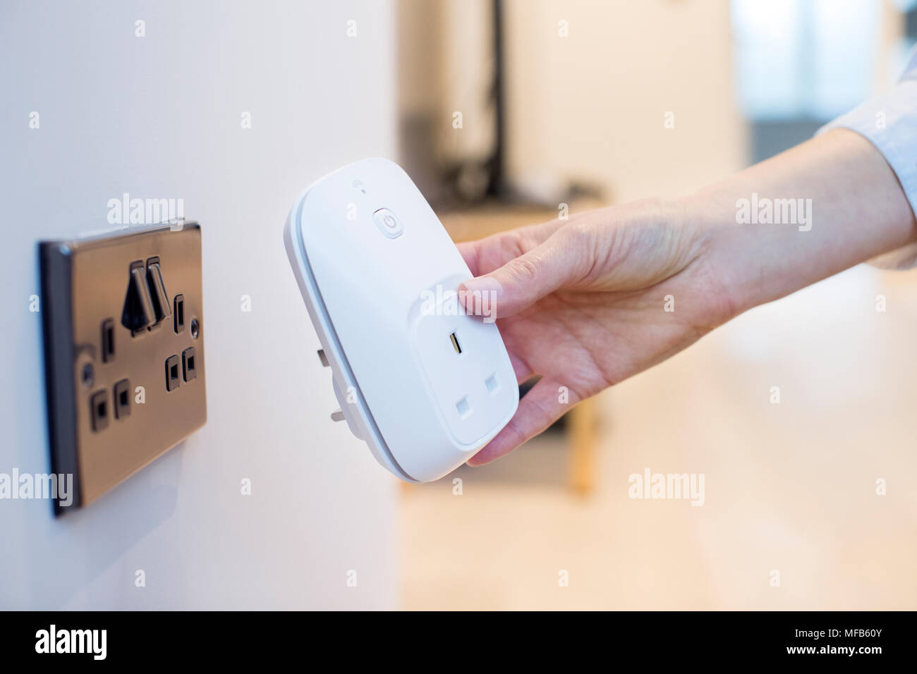 Person plugging in appliance hi-res stock photography and images - Alamy