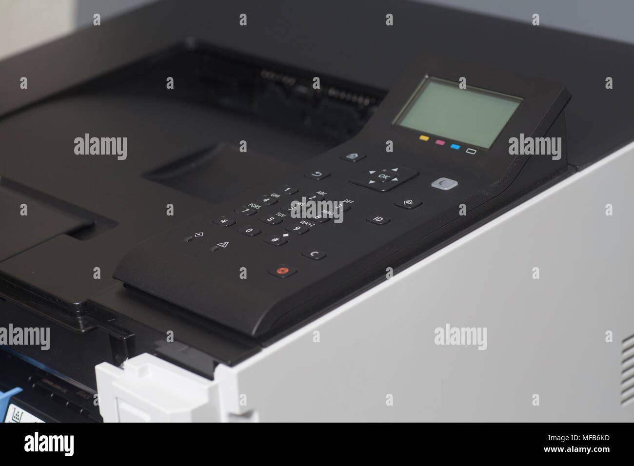 Laser color printer on a gray background Stock Photo - Alamy