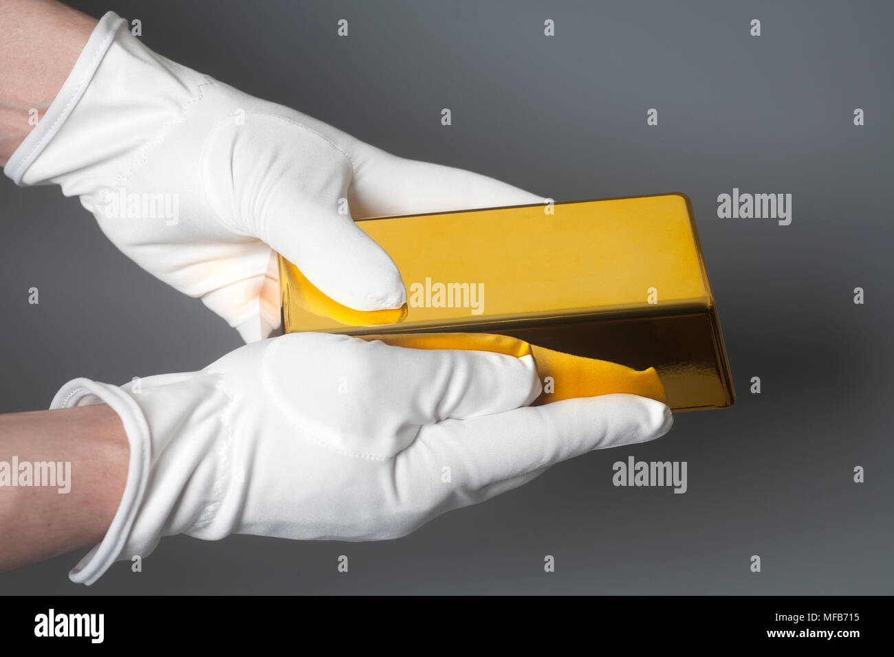 Businessman holding gold bar hi-res stock photography and images - Alamy
