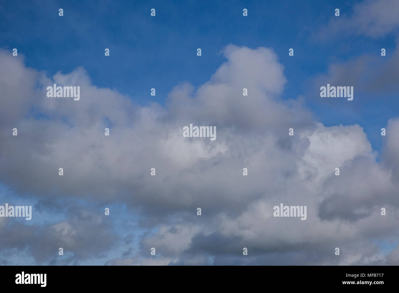Lush clouds in the sky in the spring Stock Photo - Alamy