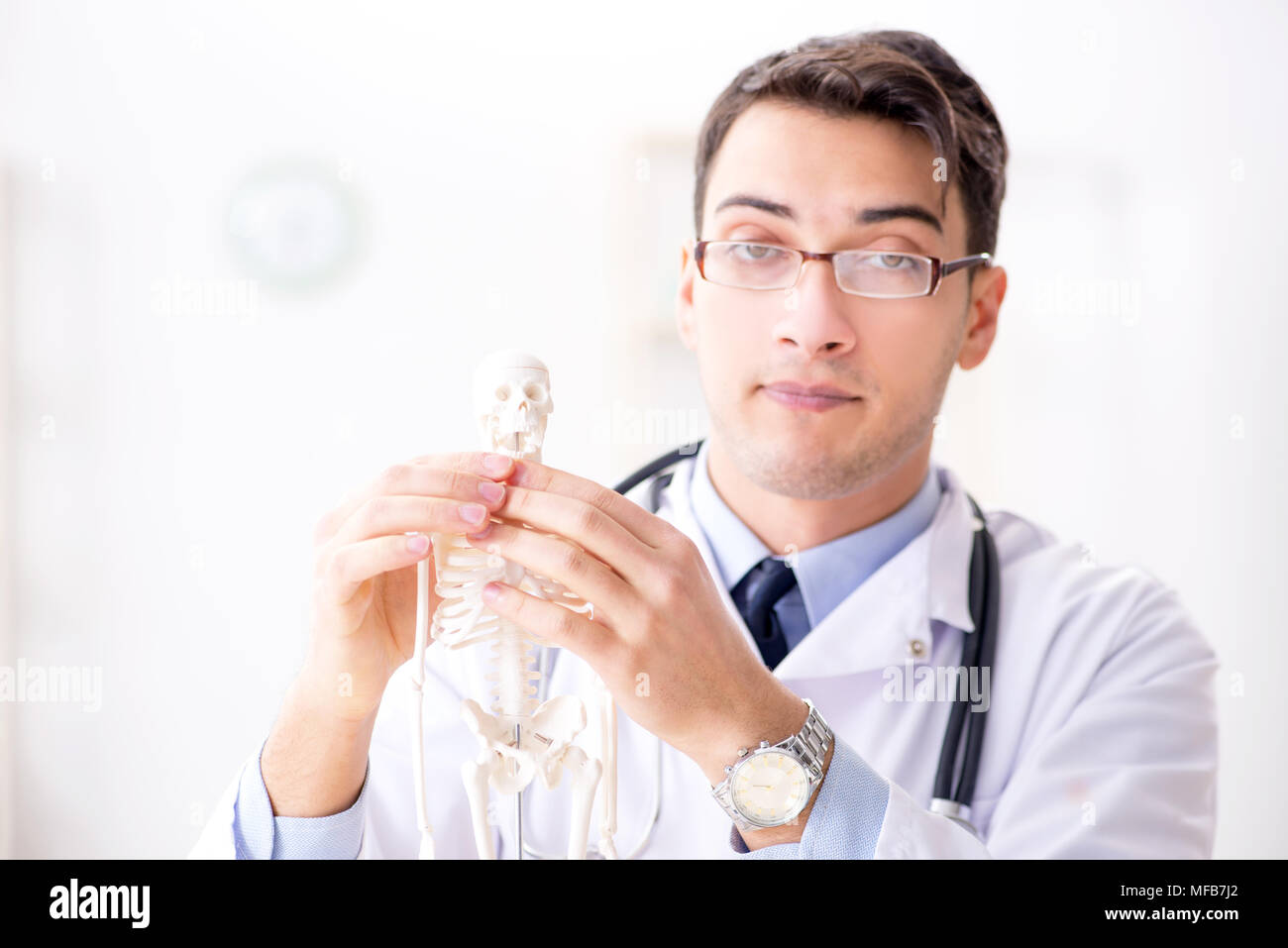 Doctor explaining human body on skeleton Stock Photo - Alamy
