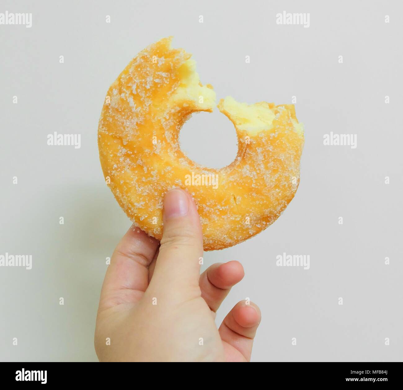 Food and Bakery, Hand Holding Delicious Fresh and Sweet Sugar Donut ...