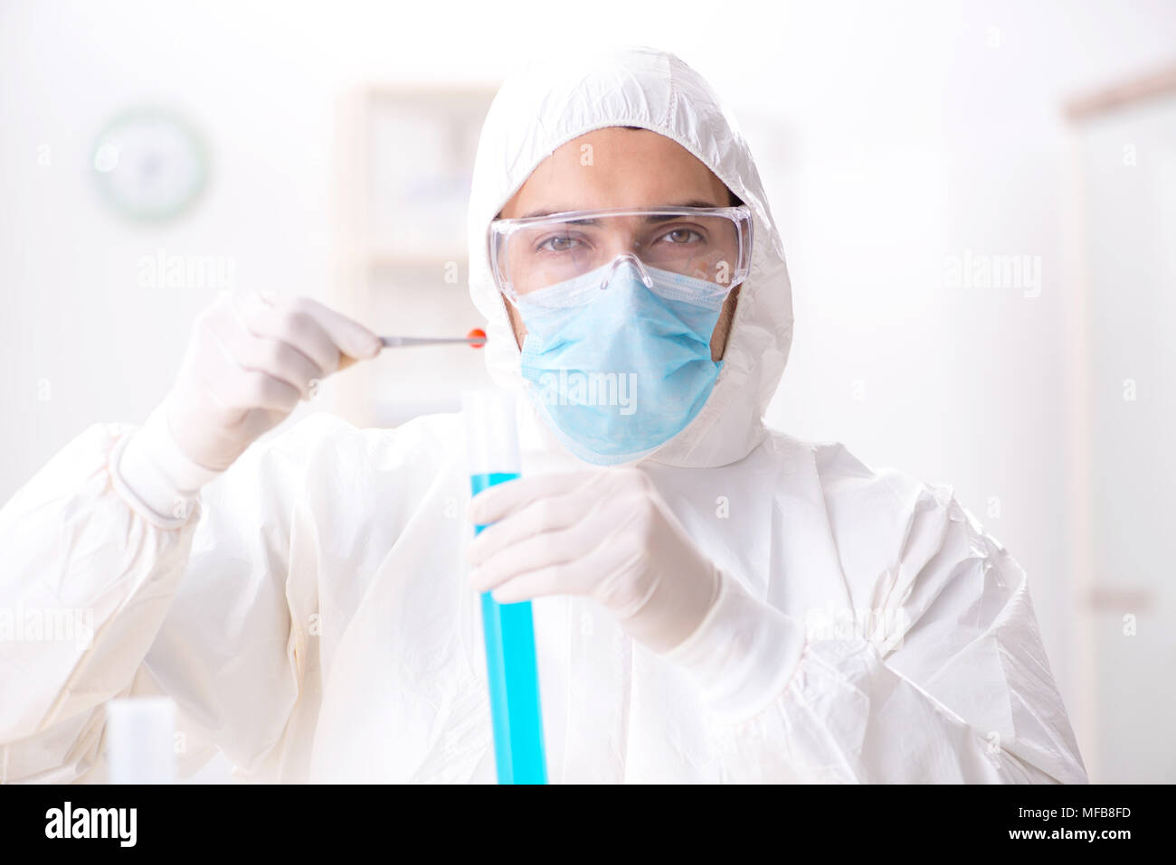 Lab assistant in drug synthesis concept Stock Photo - Alamy