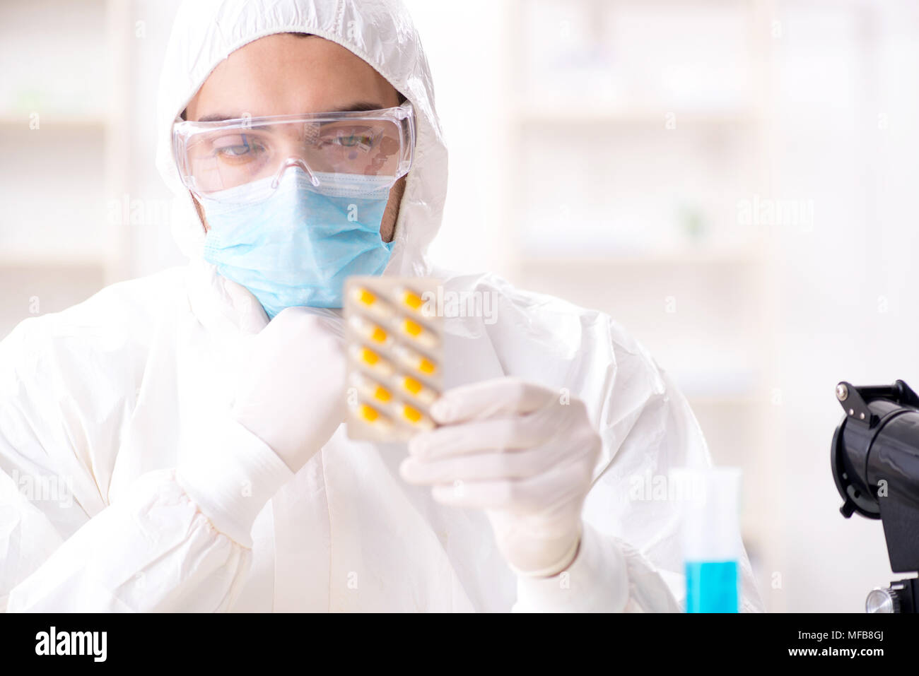 Lab assistant in drug synthesis concept Stock Photo - Alamy