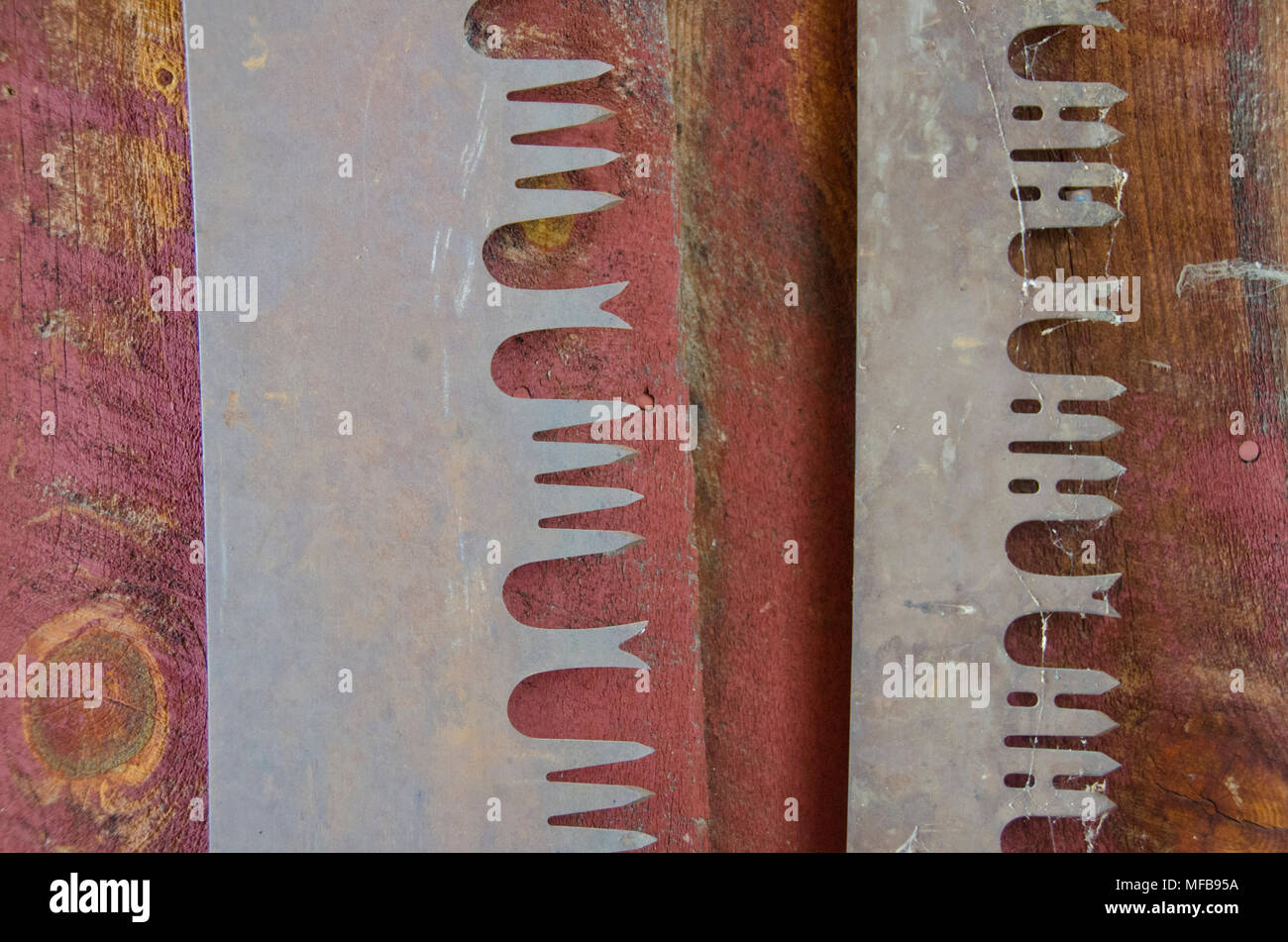 Two old crosscut saw blades look ornate in their design when ...