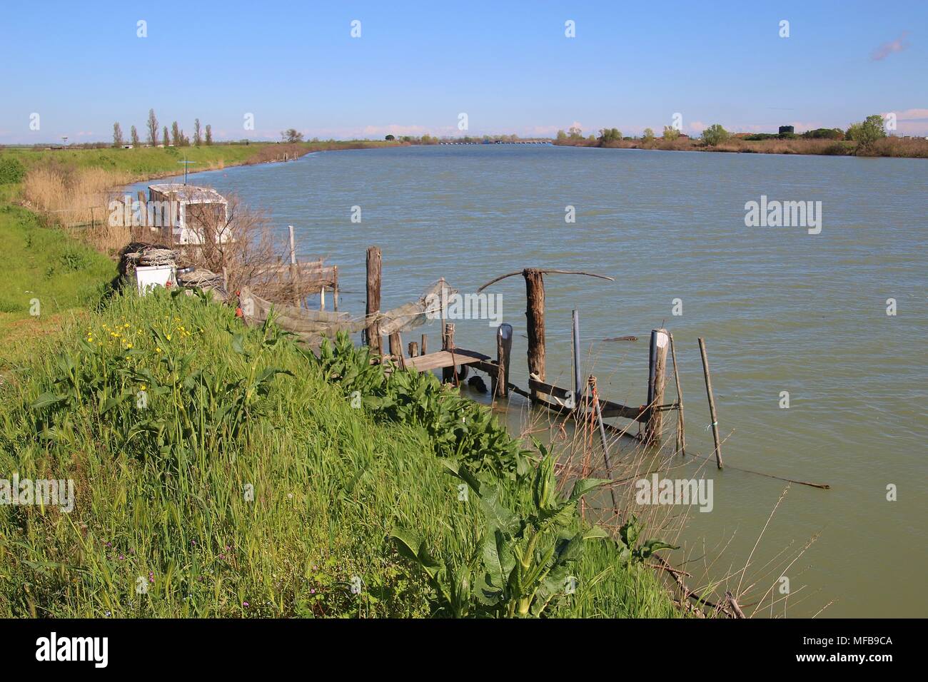 In the region Delta del Po. An arm of the Po river, Po di Goro, flows ...