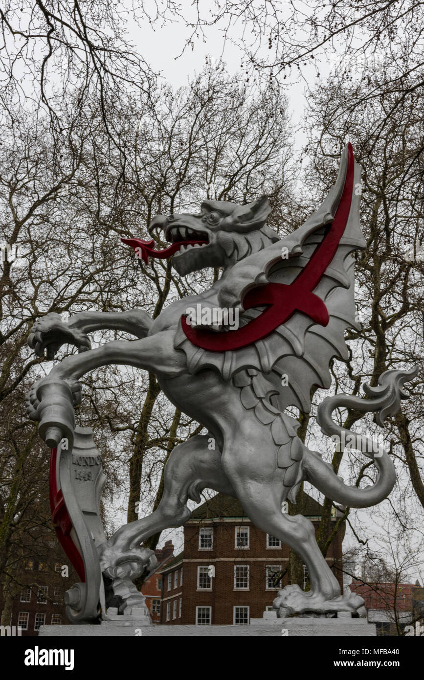 A dragon or griffin sculpture or statue on the side of the river thames ...