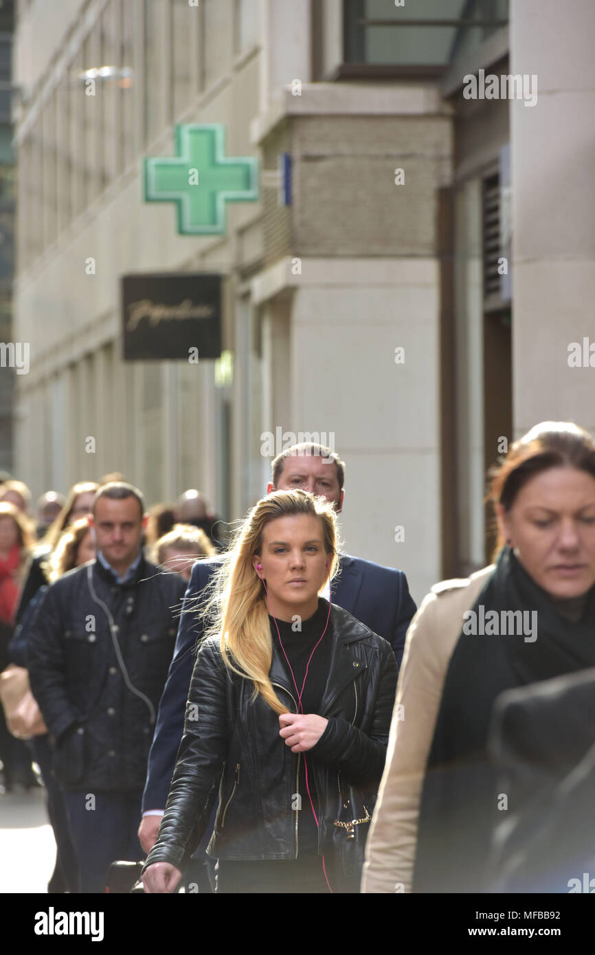 Office workers commuting to work during the morning rush hour in the ...