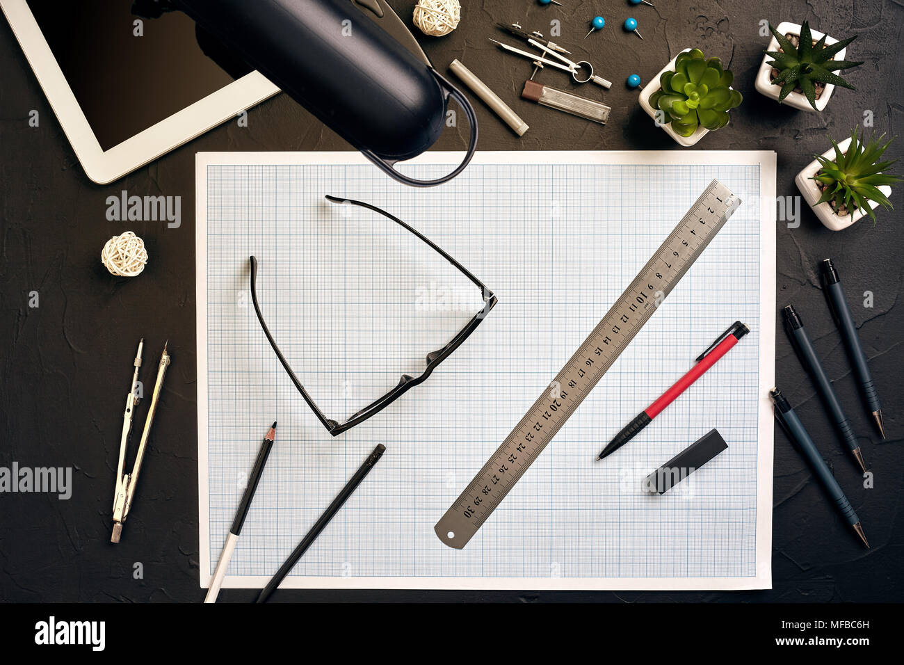 Top view of the builder's workplace, ruler, paper for drawings ...