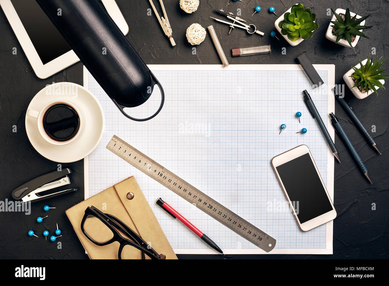 Top view of the builder's workplace, ruler, paper for drawings ...