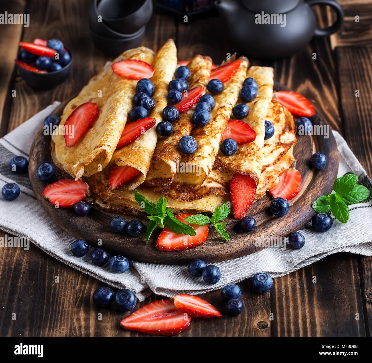 Healthy vegan pancakes crepe with blueberry and strawberry Stock Photo ...
