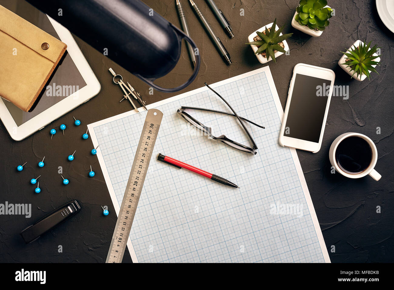 Top view of the builder's workplace, ruler, paper for drawings ...