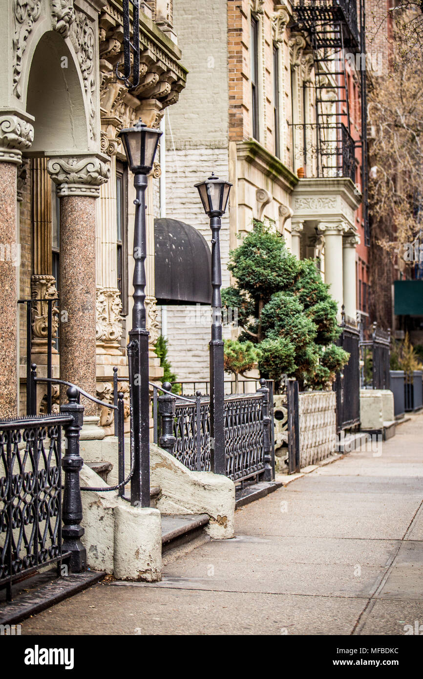 Pretty New York City street scene with apartment buildings and vintage ...