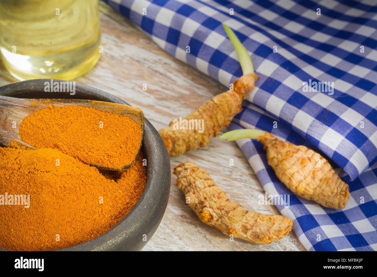 Ground turmeric in a bowl on wooden background- turmeric longa Stock ...