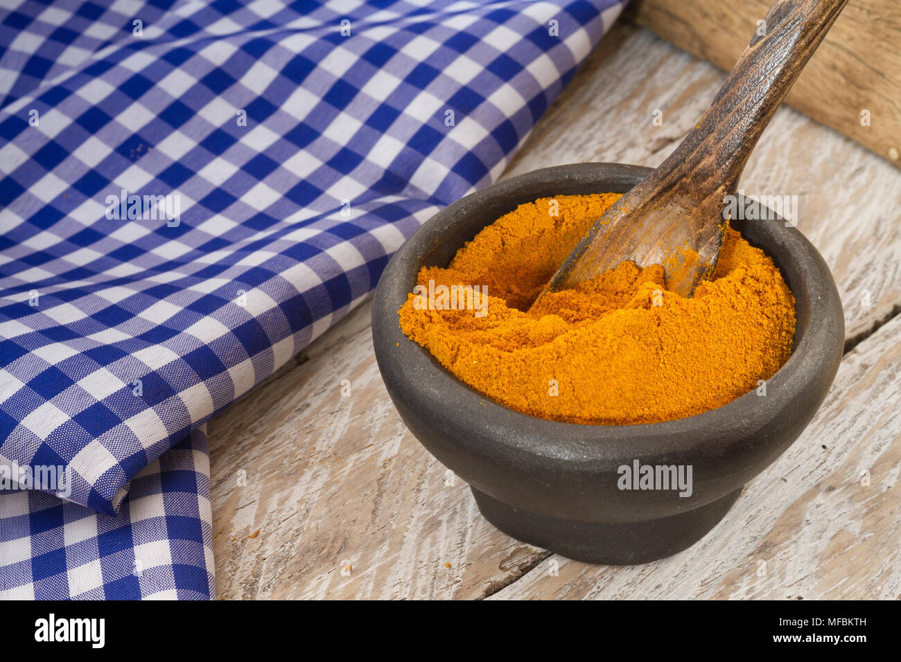 Ground turmeric in a bowl on wooden background- turmeric longa Stock ...