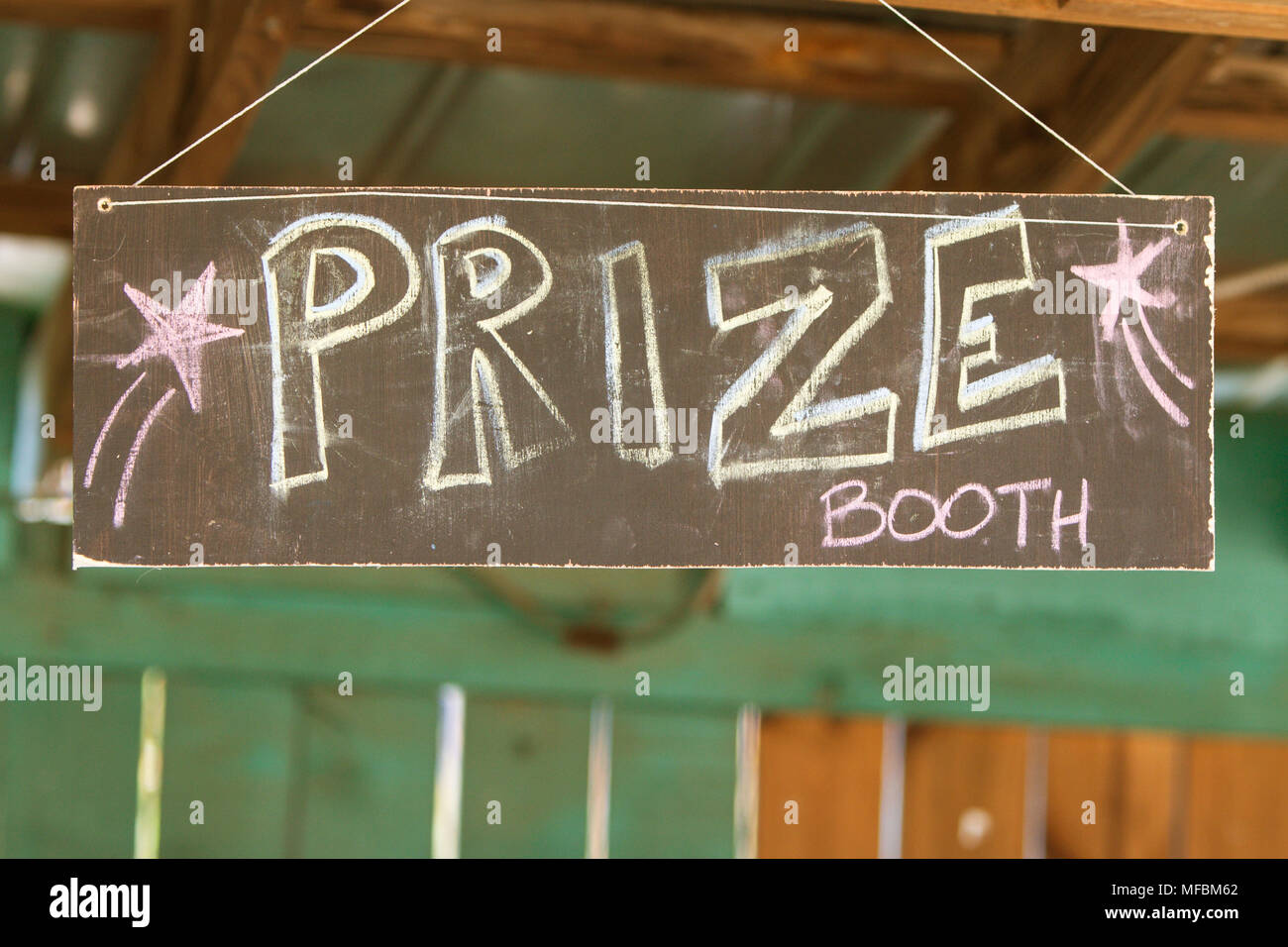 Handmade sign reads "Prize Booth" at grassroots carnival Stock Photo ...