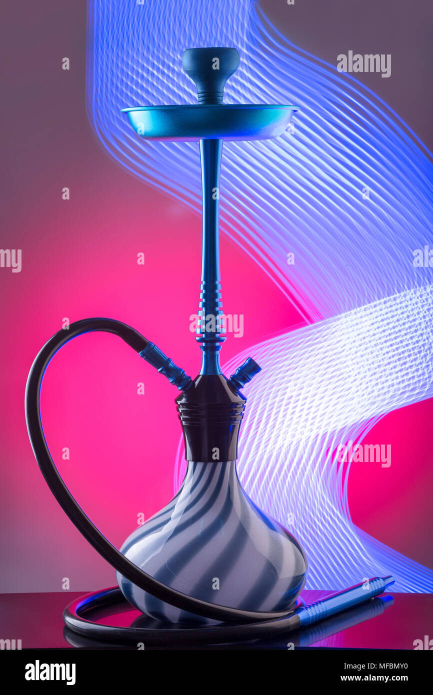 Blue eastern hookah on colorful background Stock Photo - Alamy