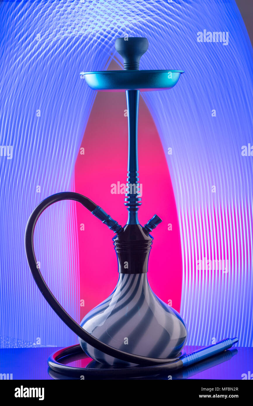 Blue eastern hookah on colorful background Stock Photo - Alamy