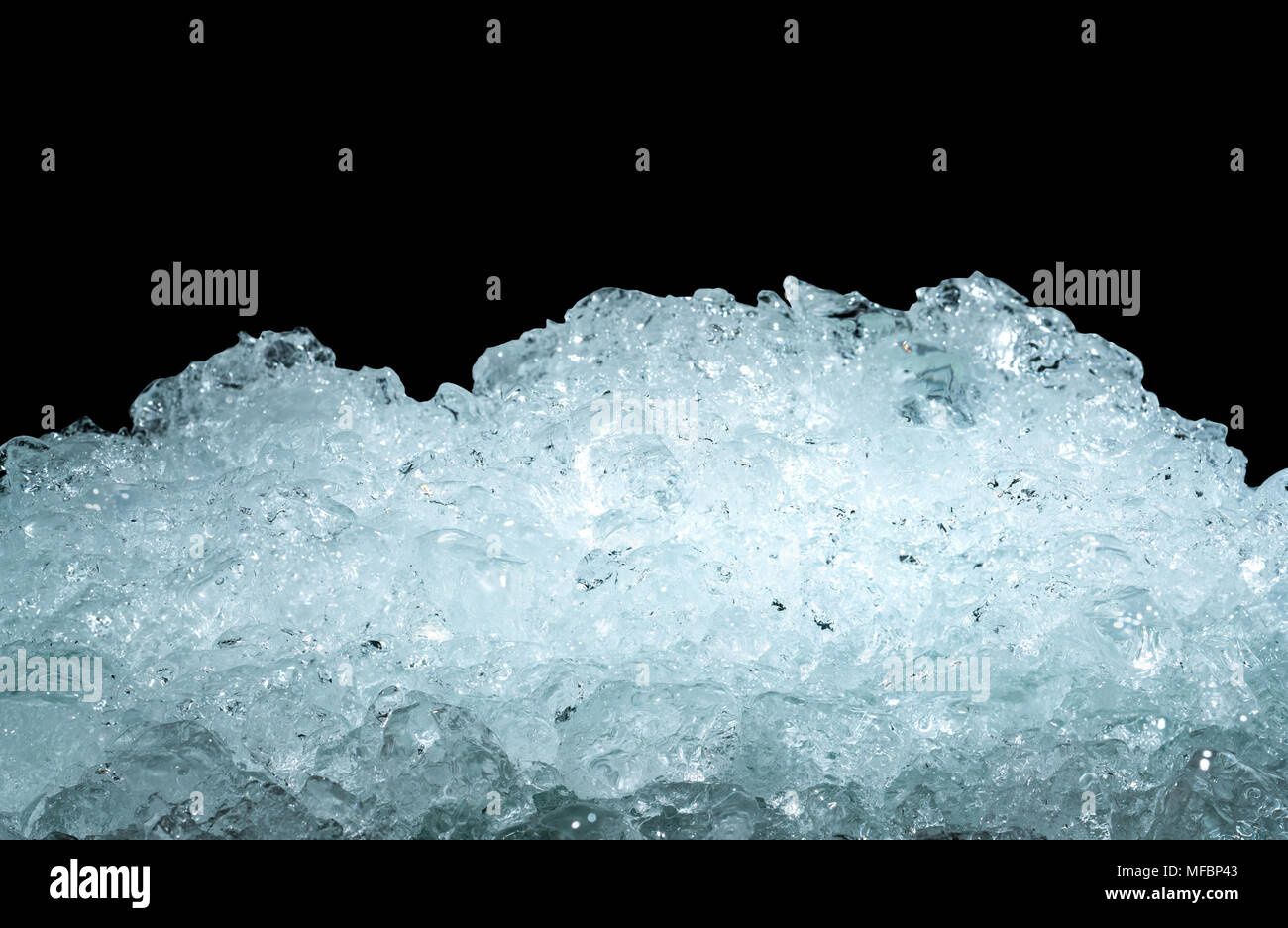 Pile of crushed ice cubes on dark background with copy space. Crushed ...