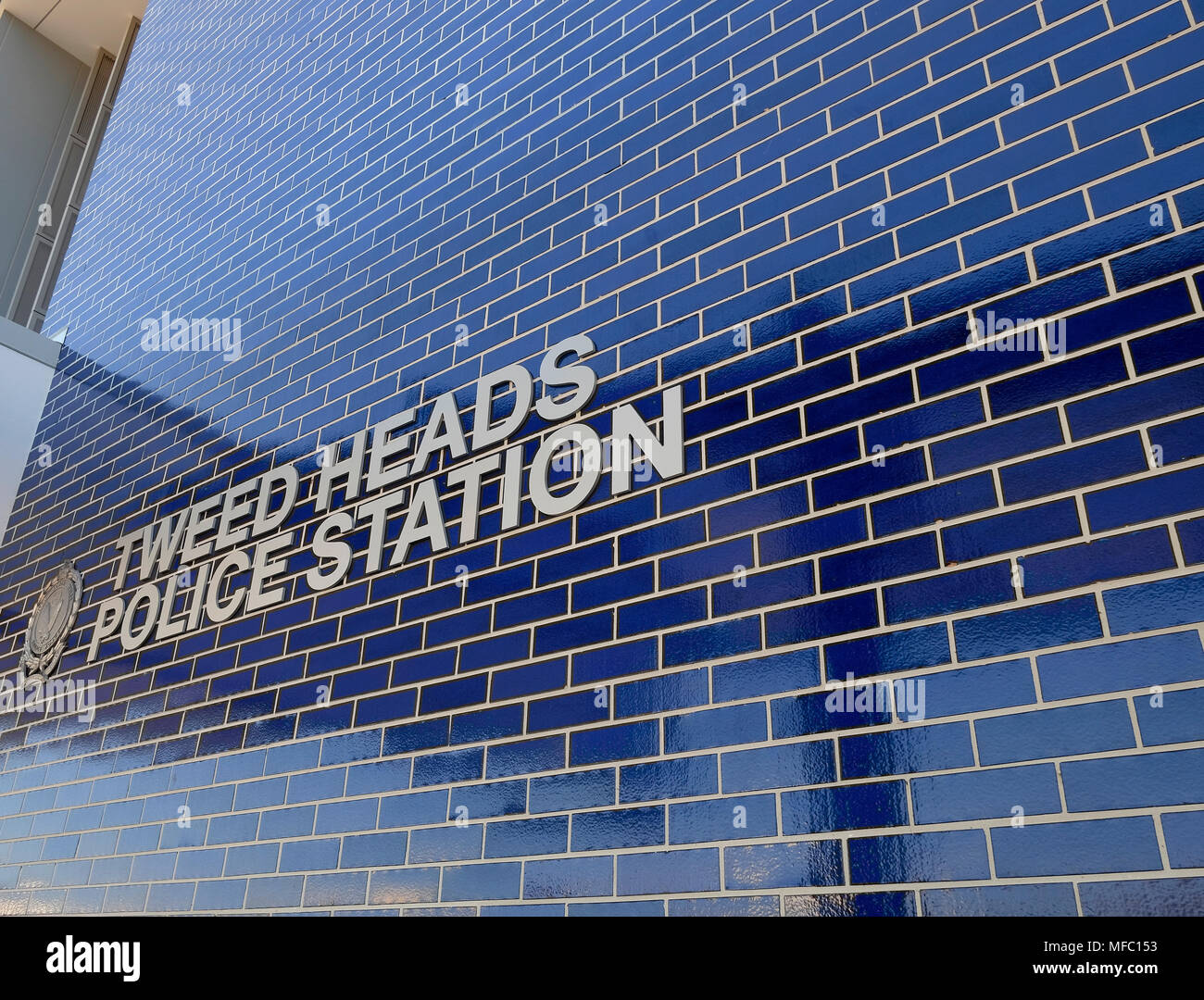 front of new Tweed Heads Police Station including sign on tiled wall ...