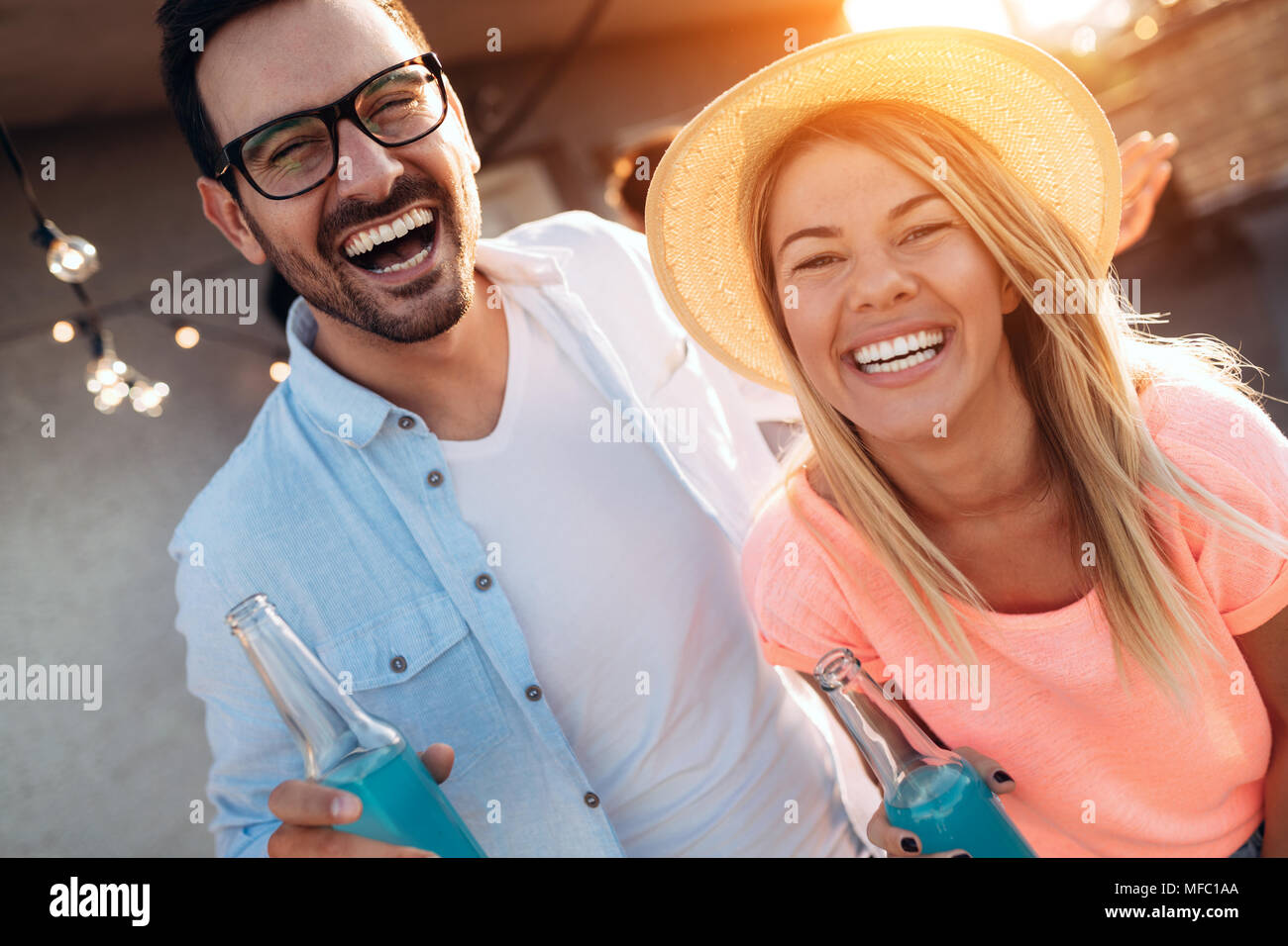Happy friends laughing and smiling outdoors Stock Photo - Alamy