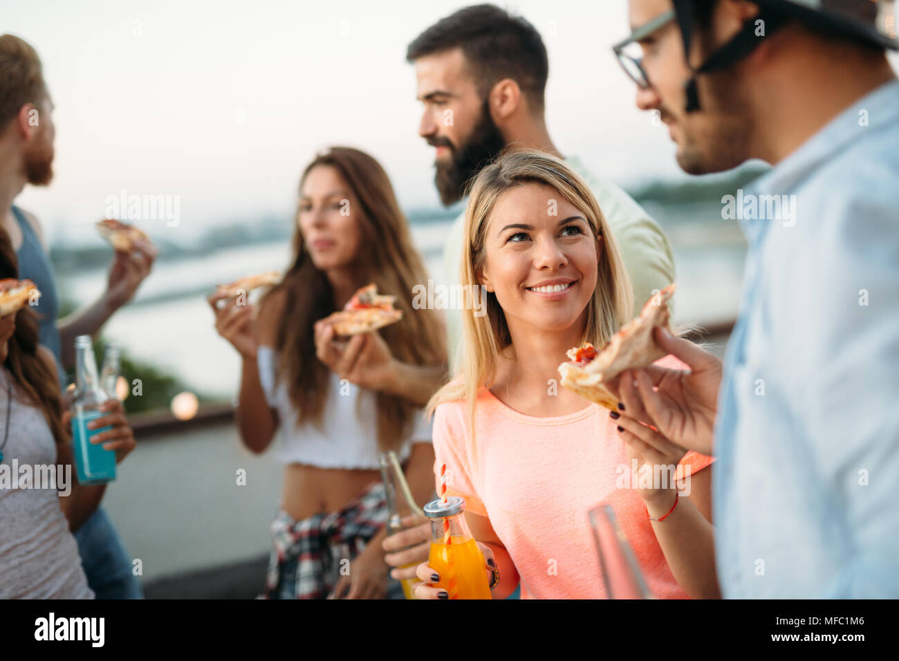 Happy friends laughing and smiling outdoors Stock Photo - Alamy